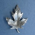 Maple Leaf lapel pins, bookmarks, keychains, coasters, maple candles ...